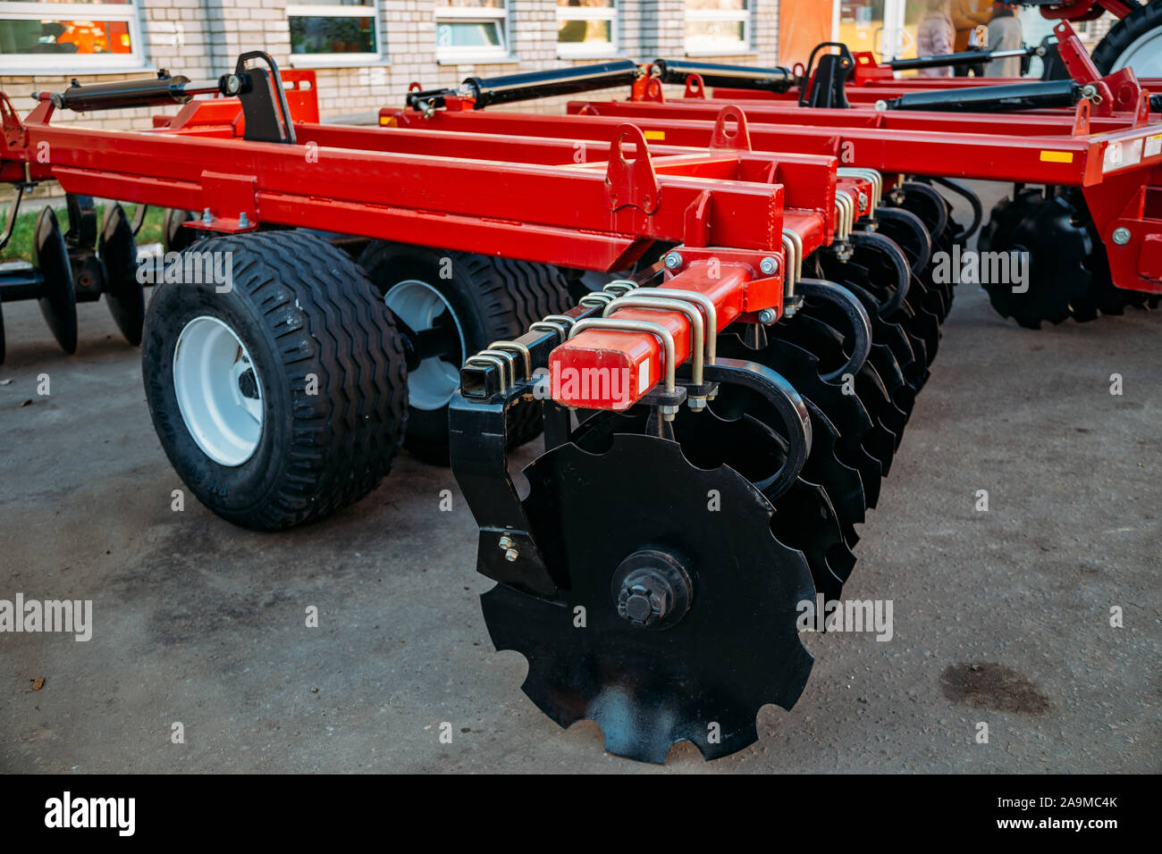 New modern agricultural disc harrow for tillage Stock Photo - Alamy