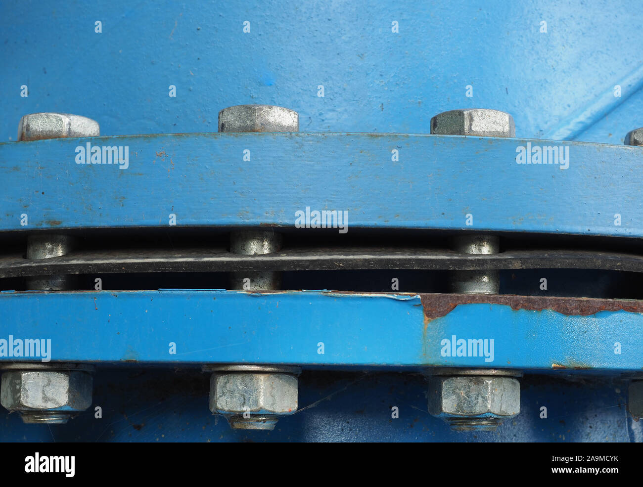 big blue steel water pipes with bolts Stock Photo - Alamy