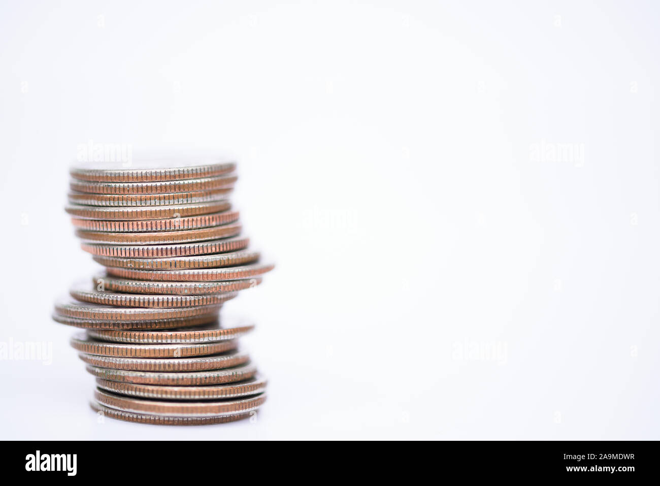 coins stacked on white background quarters and change Stock Photo - Alamy
