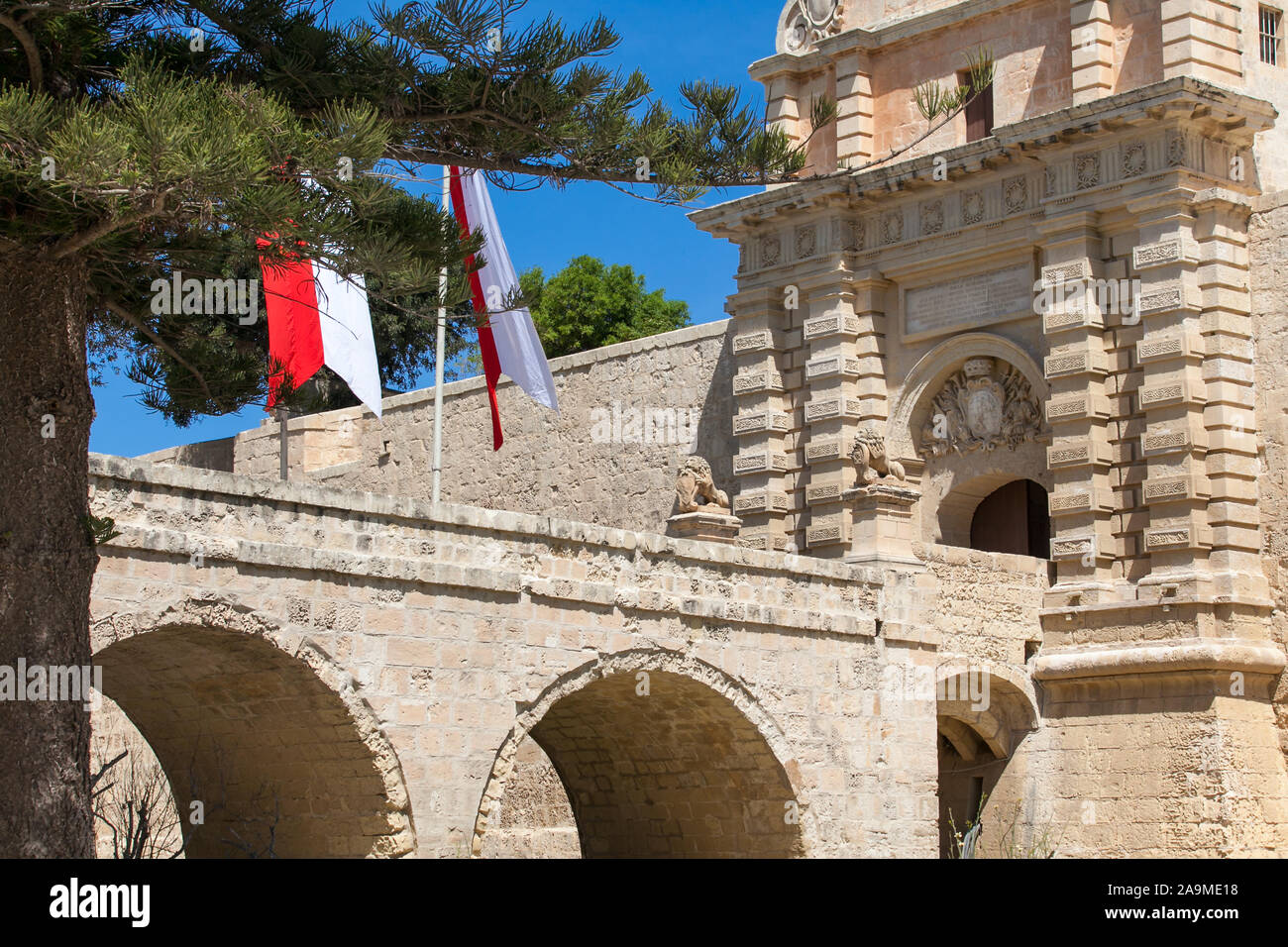 The bridge and gate leading into the medieval city of Mdina in Malta ...