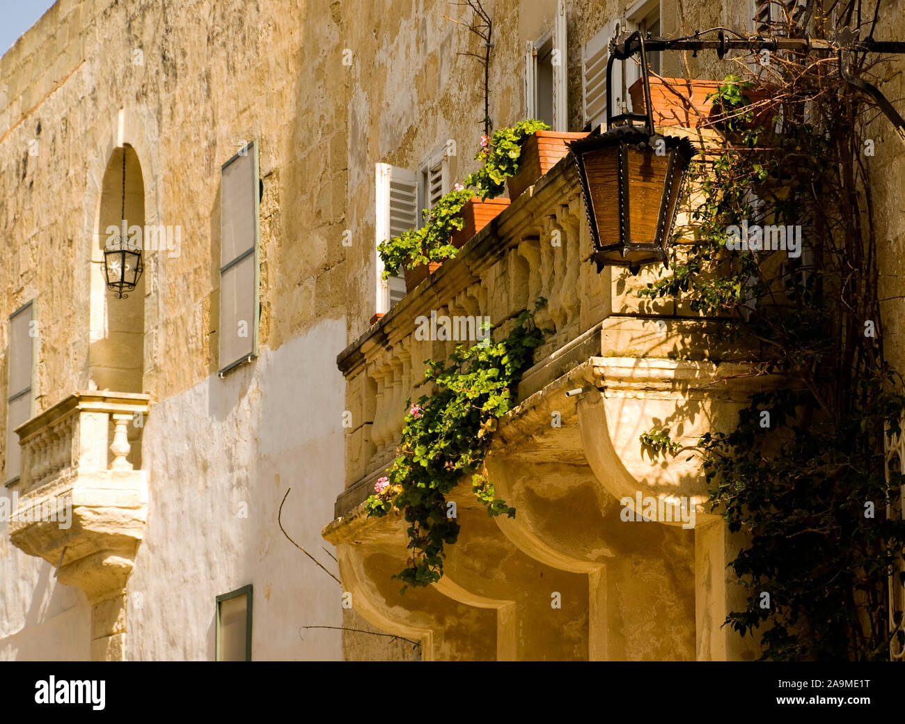 A medieval limestone balcony in traditional baroque style in Mdina on ...
