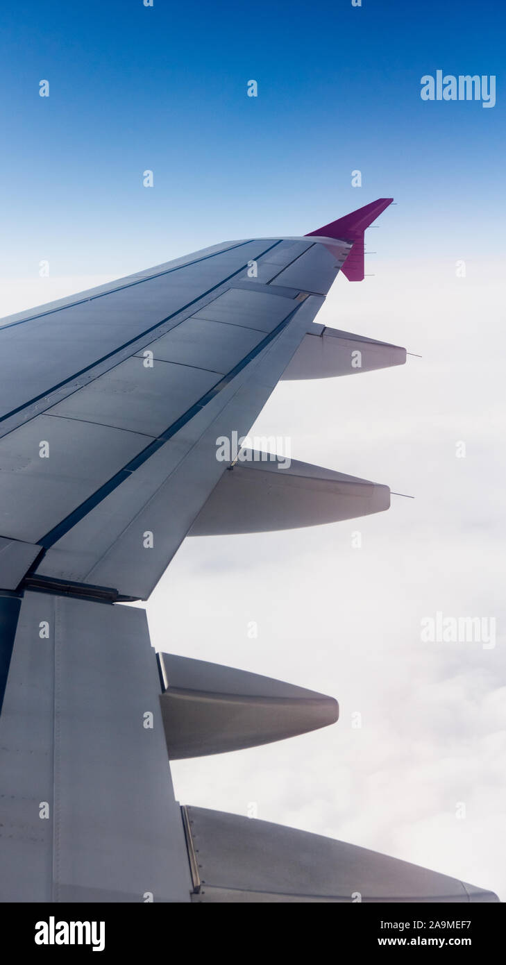 Airplane wing flying at high altitude Stock Photo - Alamy