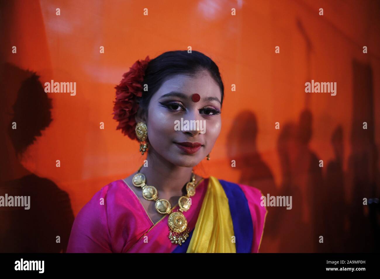 Dhaka, Bangladesh. 16th Nov, 2019. A girl poses for a photo backstage ...