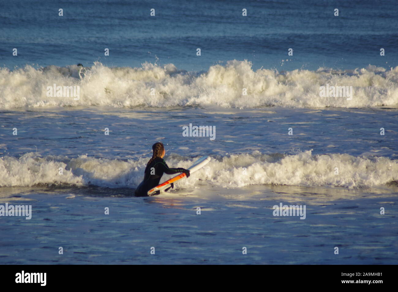 Female Surfer in the North Sea on a Winters Evening. Aberdeen, Scotland ...