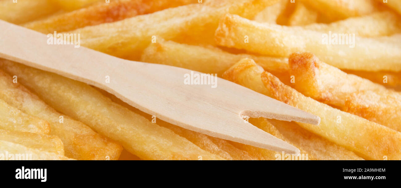 French fries with fork background Stock Photo - Alamy