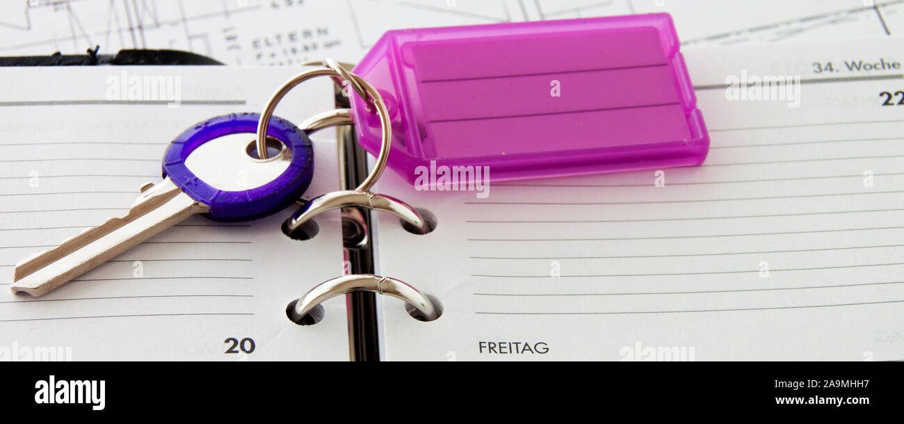 Calendar with key fob close-up as background Stock Photo - Alamy