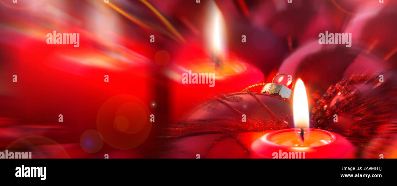 Christmas red candles with candle light and decoration Stock Photo - Alamy