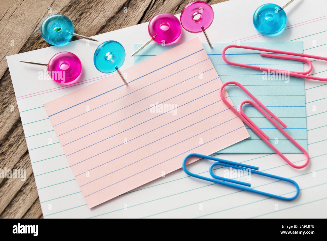 Pin needles and label Stock Photo - Alamy