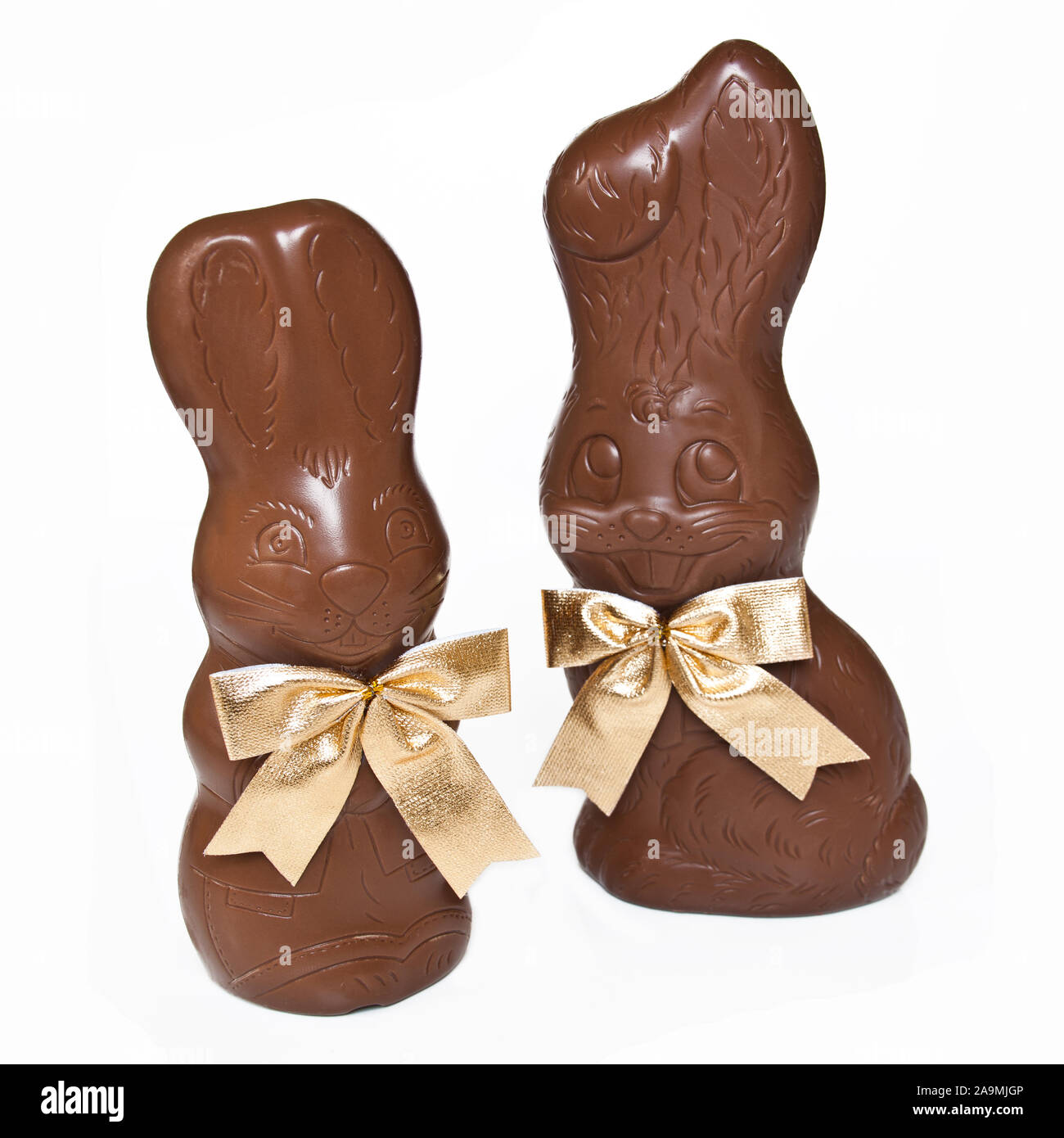Chocolate Easter bunny with golden ribbon on white background Stock ...