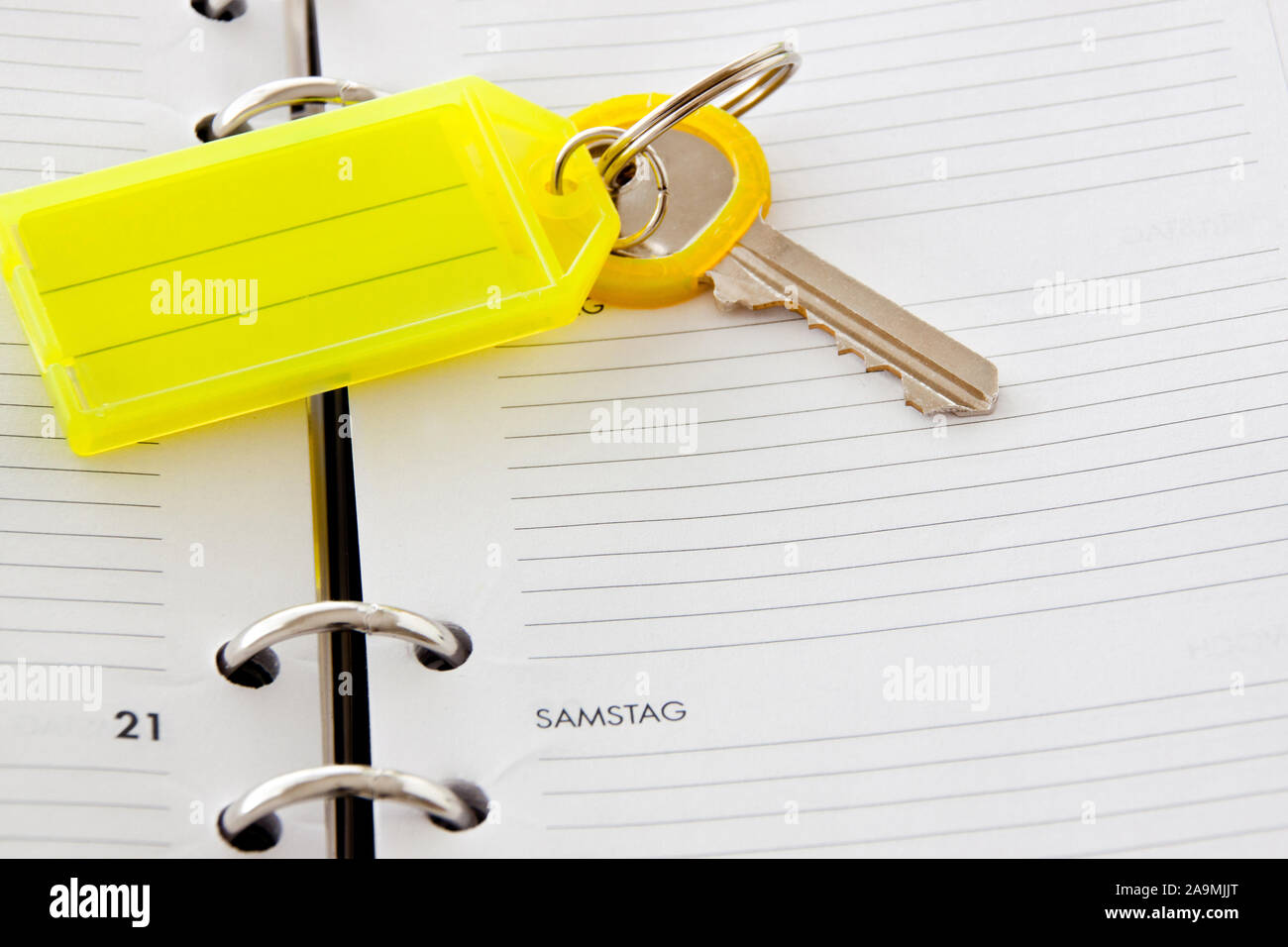 Calendar with key fob close-up as background Stock Photo - Alamy