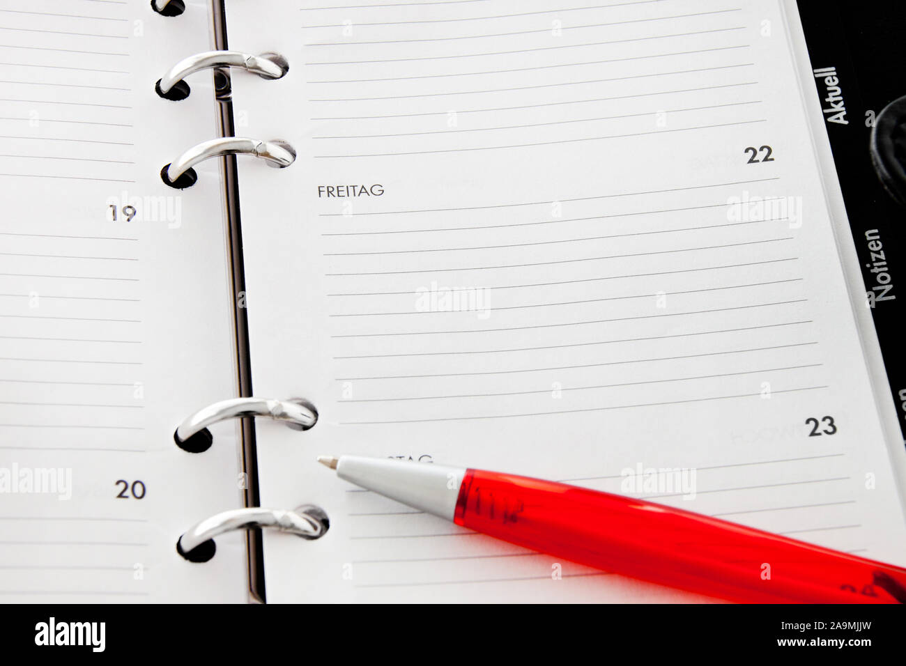 Calendar with red ballpoint pen close-up as background Stock Photo - Alamy