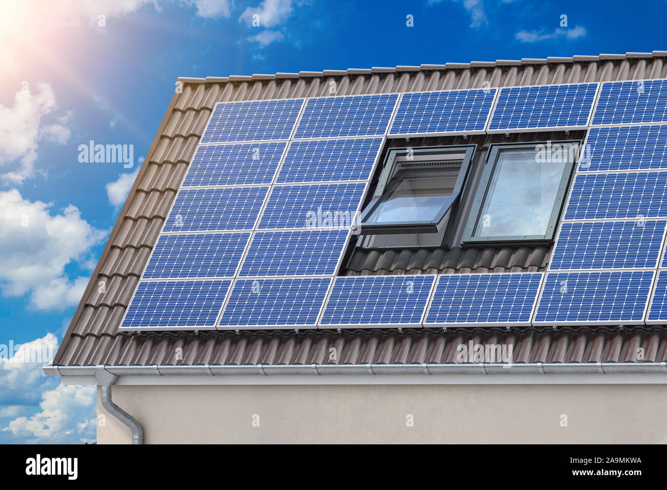 Solar panels for green energy on the tiled roof of suburban house ...