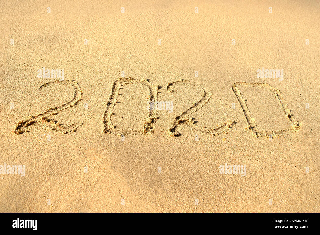2020 on beach sand. New year 2020 on beach sand. New year concept. 2020 ...