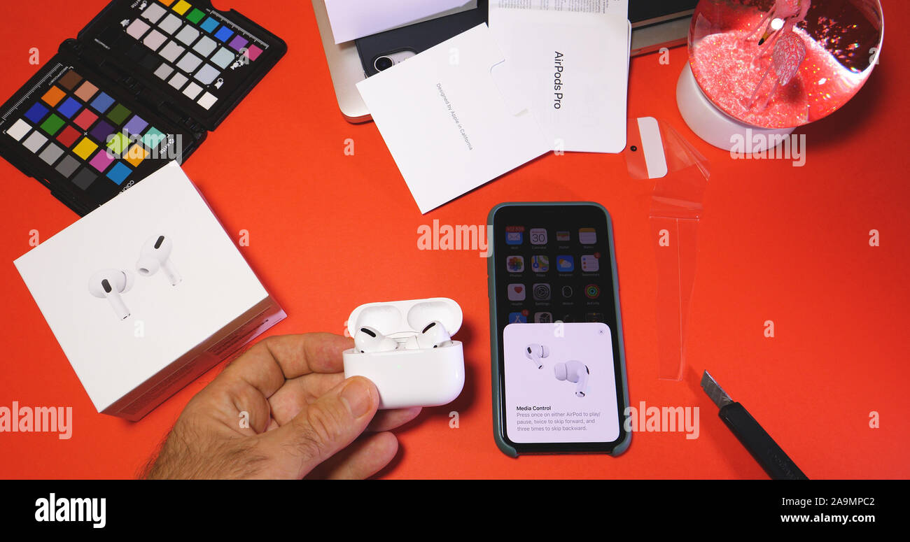 Paris, France - Oct 30, 2019: Overhead view of male hands unboxing new ...