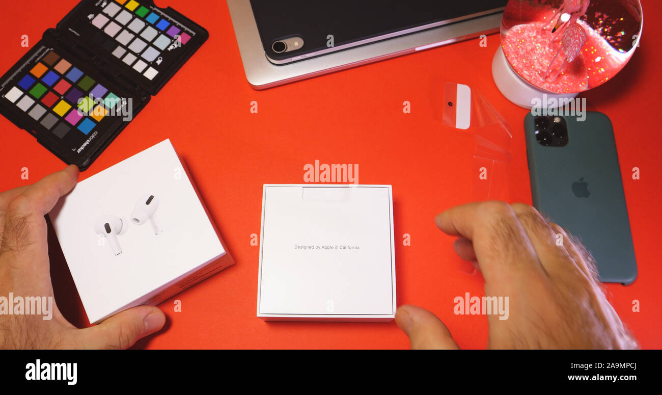 Paris, France - Oct 30, 2019: Overhead view of male hands unboxing new ...