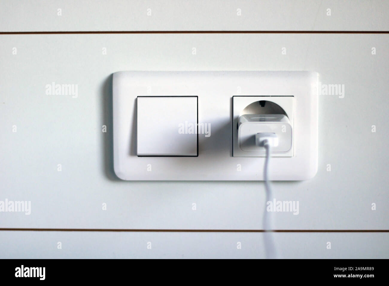 Electronic device with plug hi-res stock photography and images - Alamy