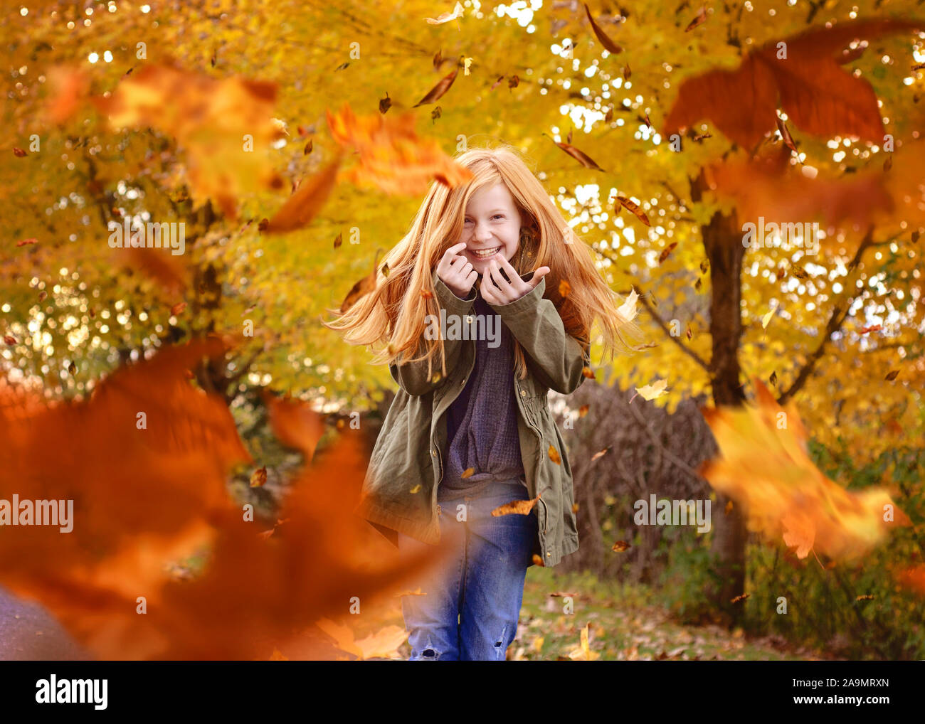 Child falling leaves hi-res stock photography and images - Alamy