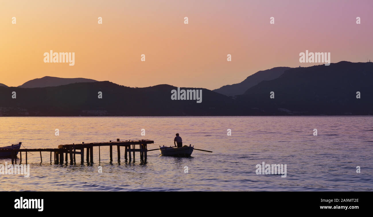 Fisherman rowing boat twilight hi-res stock photography and images - Alamy