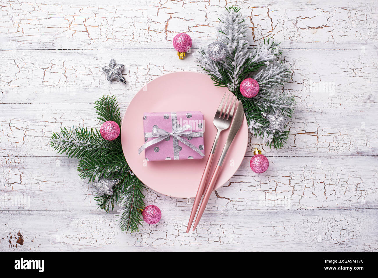 Christmas table setting in pink color Stock Photo - Alamy