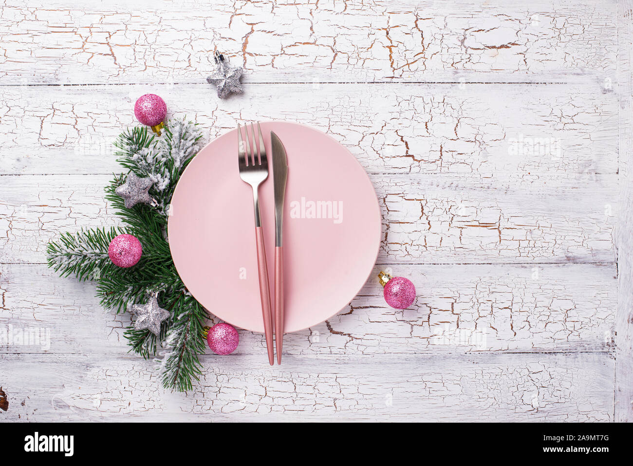 Christmas table setting in pink color Stock Photo - Alamy
