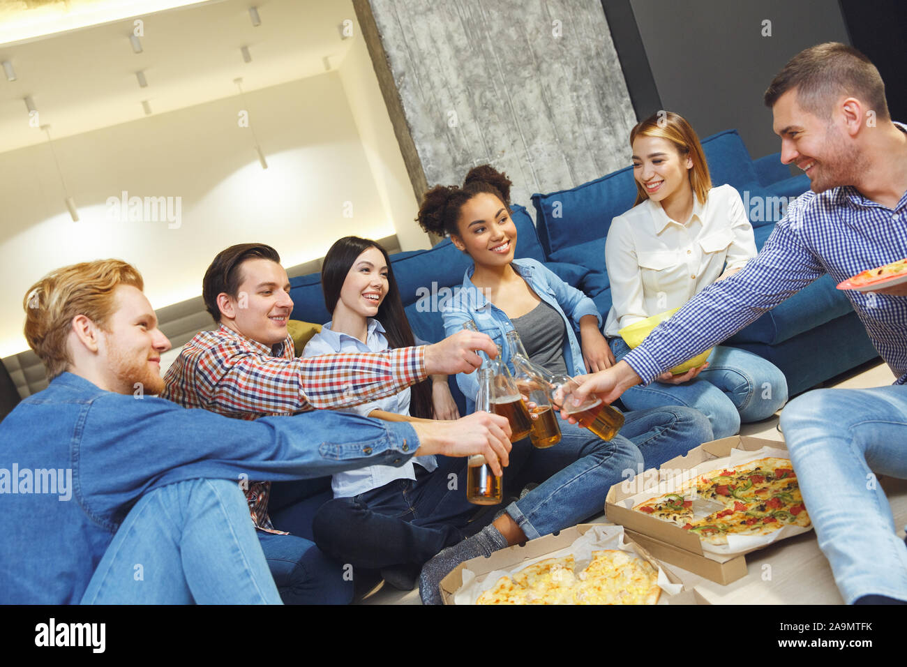 Group of friends having party indoors fun together cheers Stock Photo ...