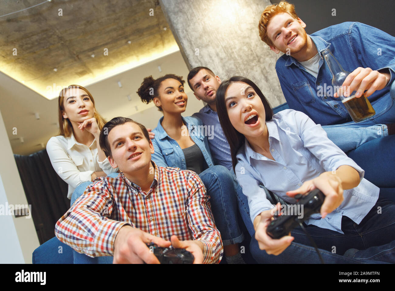 Group of friends having party indoors fun together Stock Photo - Alamy