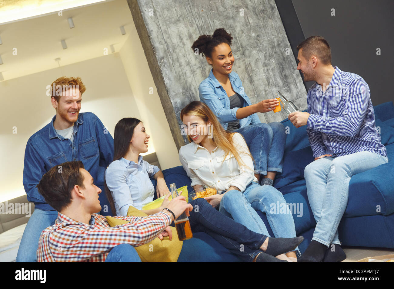 Group of friends having party indoors fun together talking Stock Photo ...
