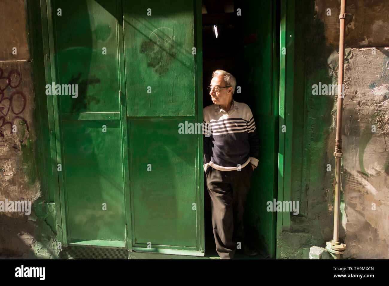 Man standing in front of metal gate hi-res stock photography and images ...