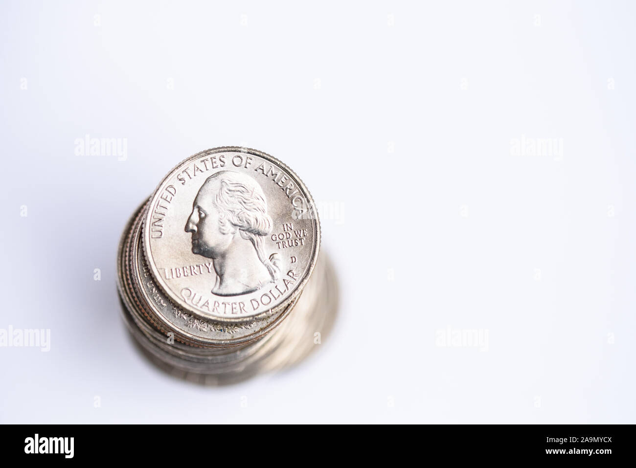 coins stacked on white background quarters and change Stock Photo - Alamy
