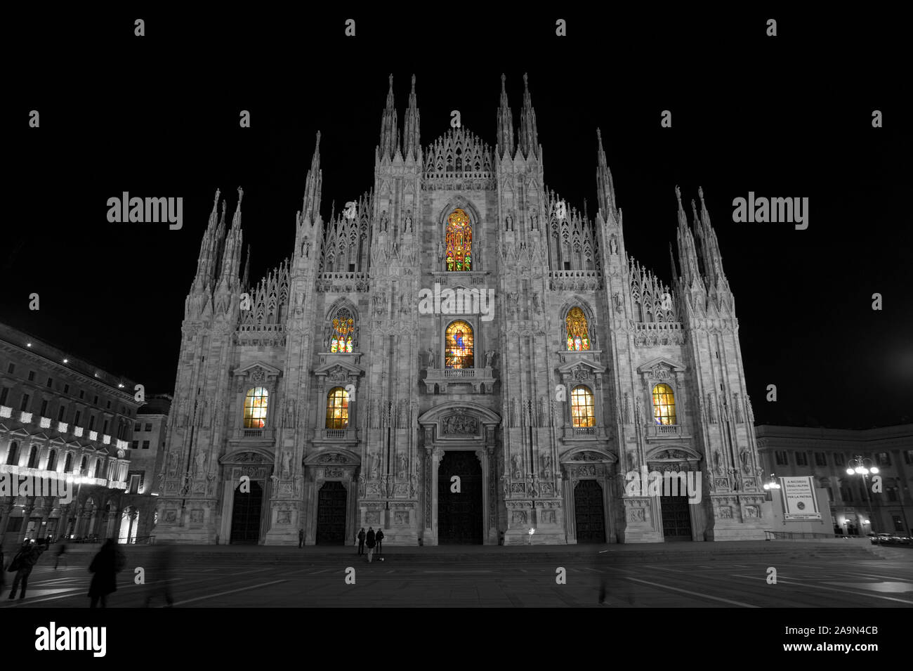 Milan Cathedral at night with backlit glass windows Stock Photo - Alamy