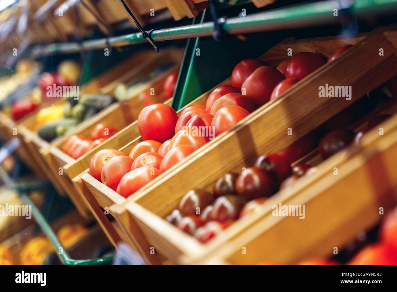 Daily Shopping. Boxes with vegetables in supermarket no people tomatoes ...