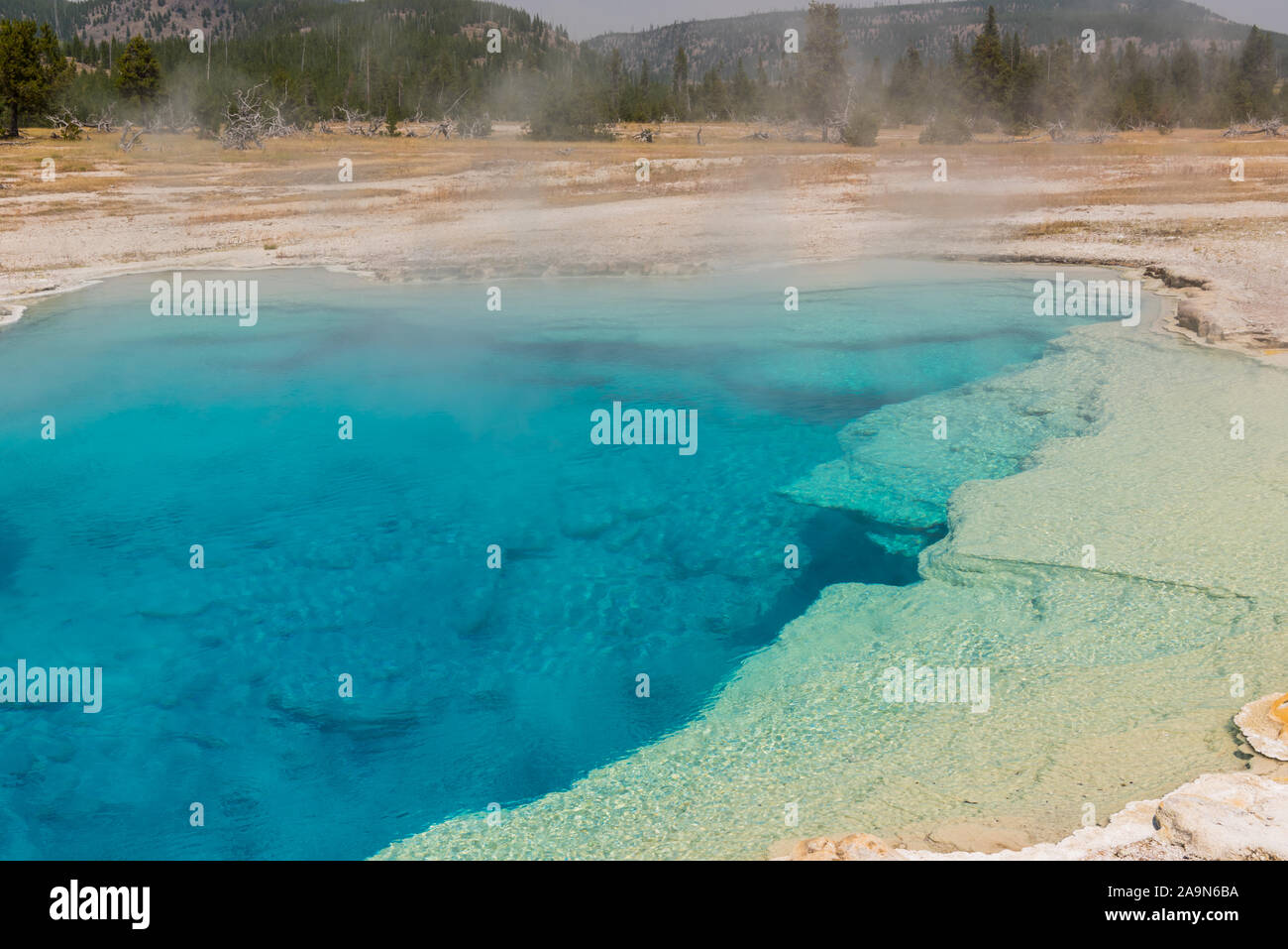 Deep Blue Hot Springs Blows Steam into the summer air Stock Photo - Alamy