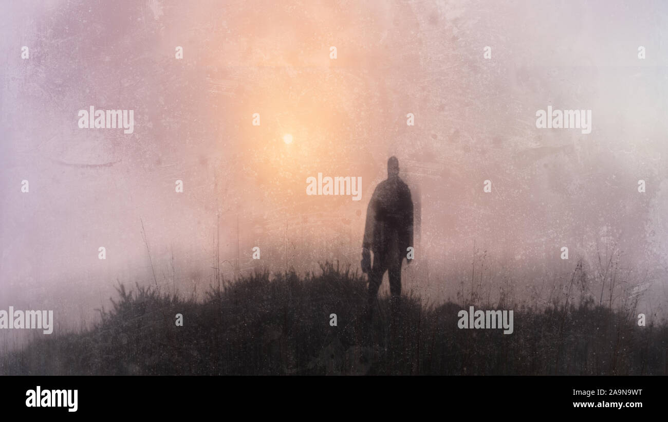 A mysterious figure wearing a long coat, with back to camera, standing ...