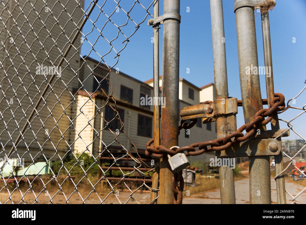 Old abandoned fenced off industrial factory Stock Photo - Alamy