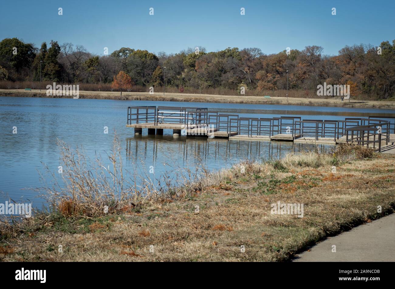 Small bridge standing in the middle of the lake some where in the park ...