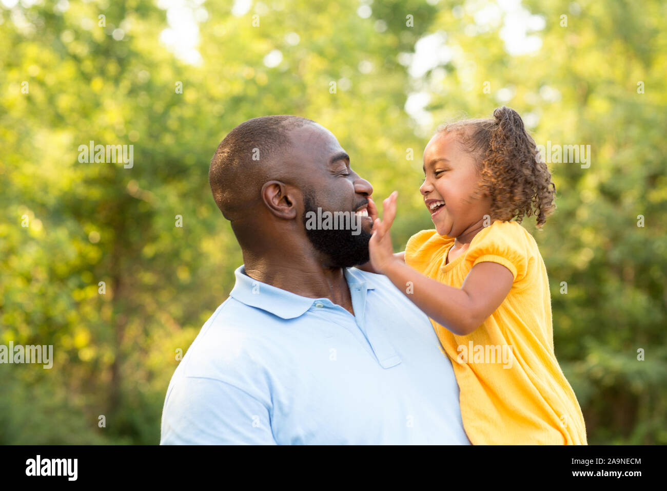 Father laughing and playing with his daugher Stock Photo - Alamy