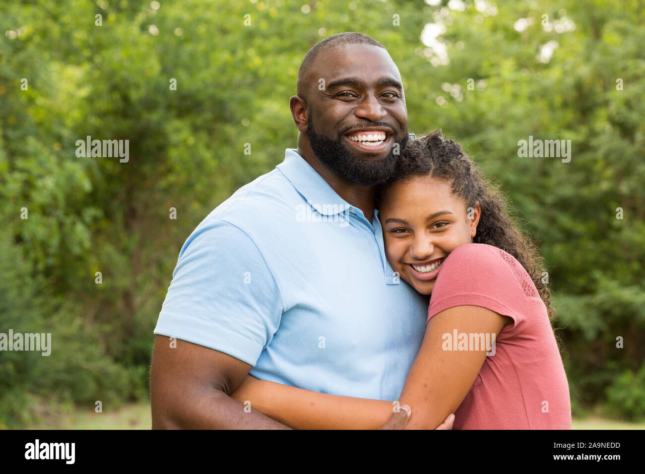 Father and his daughter laughing and playing at the park Stock Photo ...