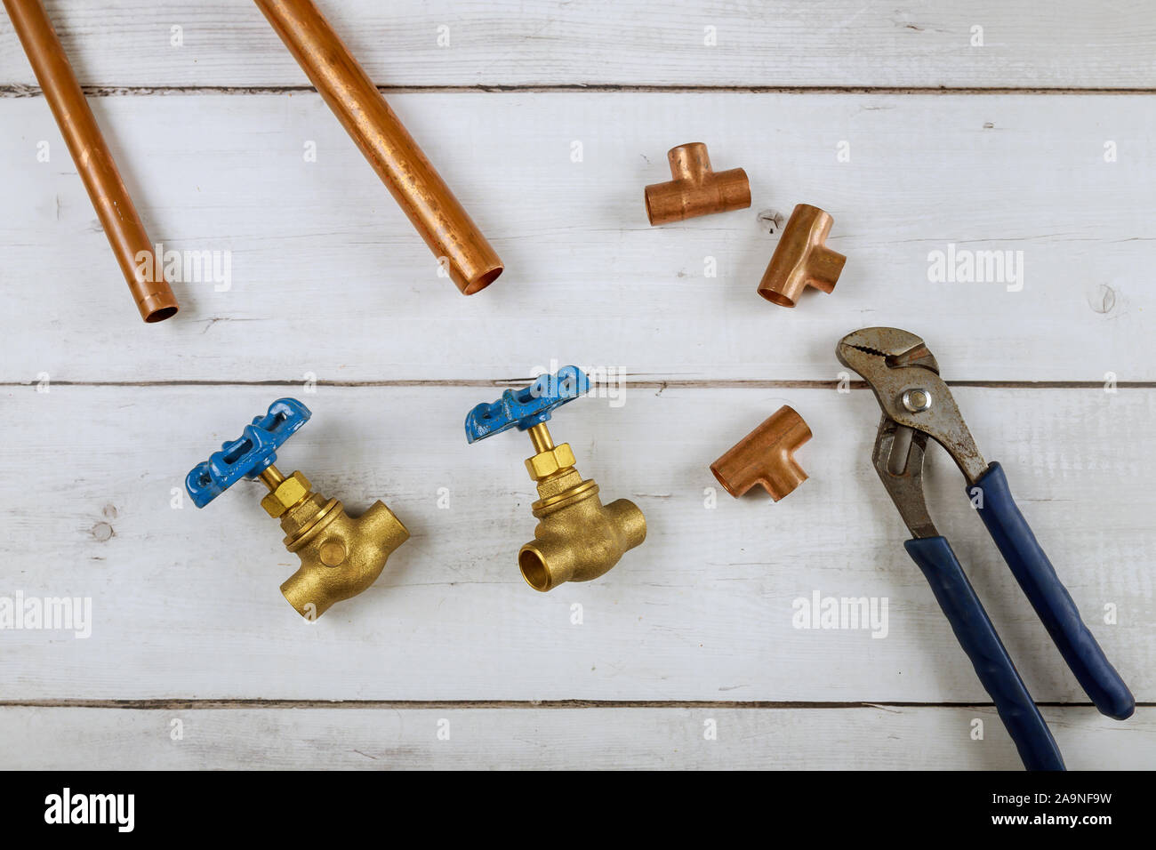Brass gate valve on wooden background, monkey wrench brass plumbing ...
