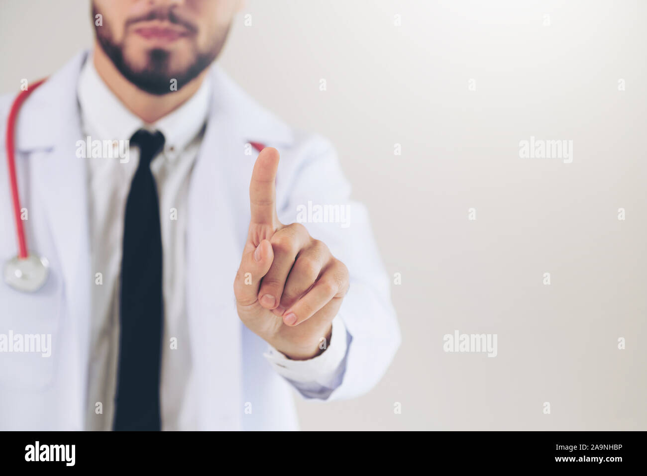 Male Doctor Pointing Finger At Blank Space On White Background Selective Focus At Doctors