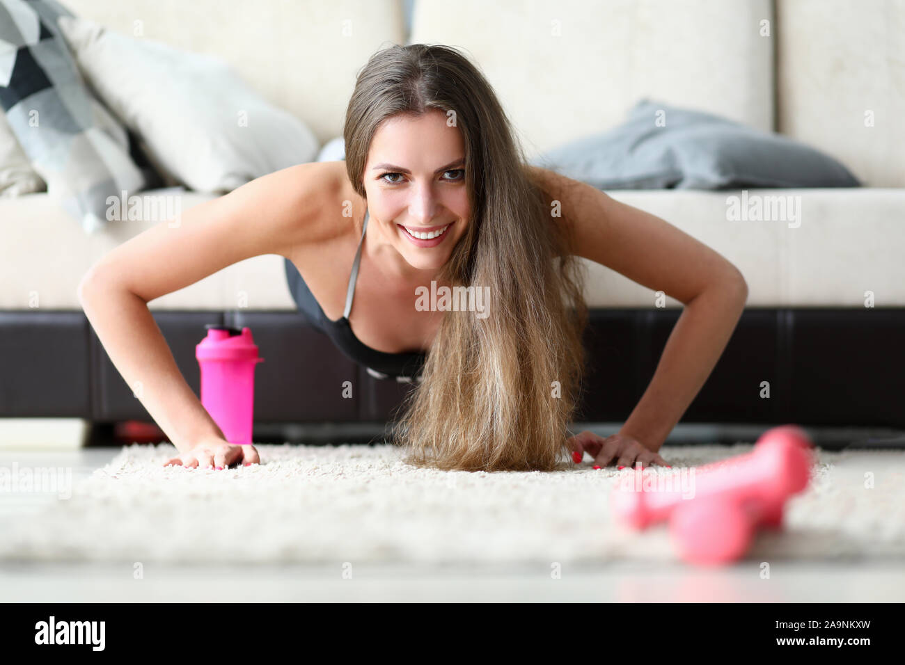 Cute lady pushing up Stock Photo - Alamy
