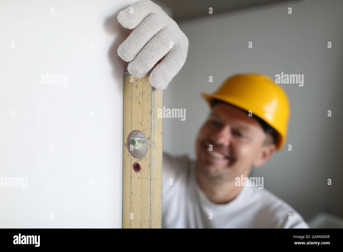 Worker with measuring ruler Stock Photo - Alamy
