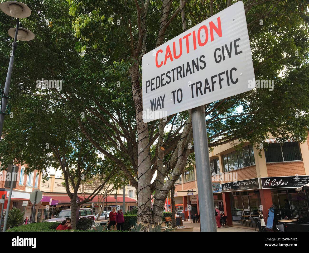 Sign for pedestrians to give traffic right of way in Gympie Queensland ... Sign for pedestrians to give traffic right of way in Gympie Queensland ...