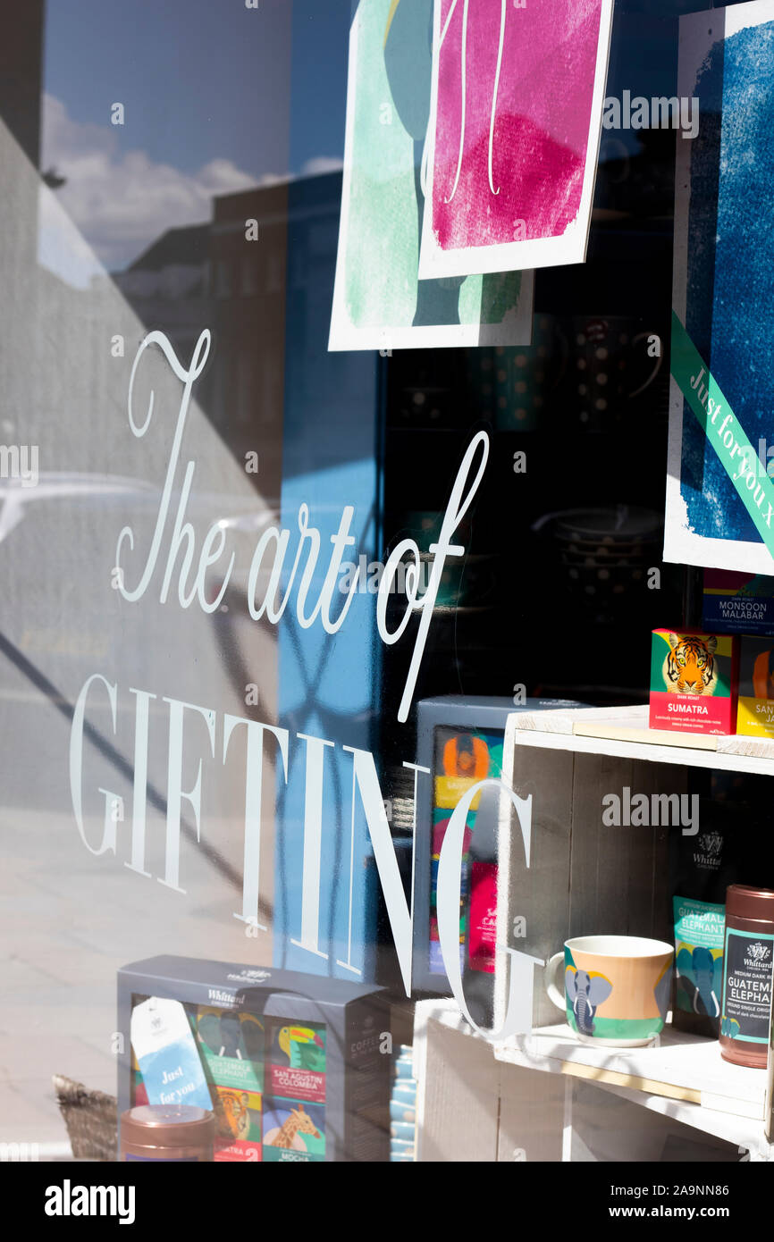 the art of gifting sign in retail shop window Stock Photo - Alamy