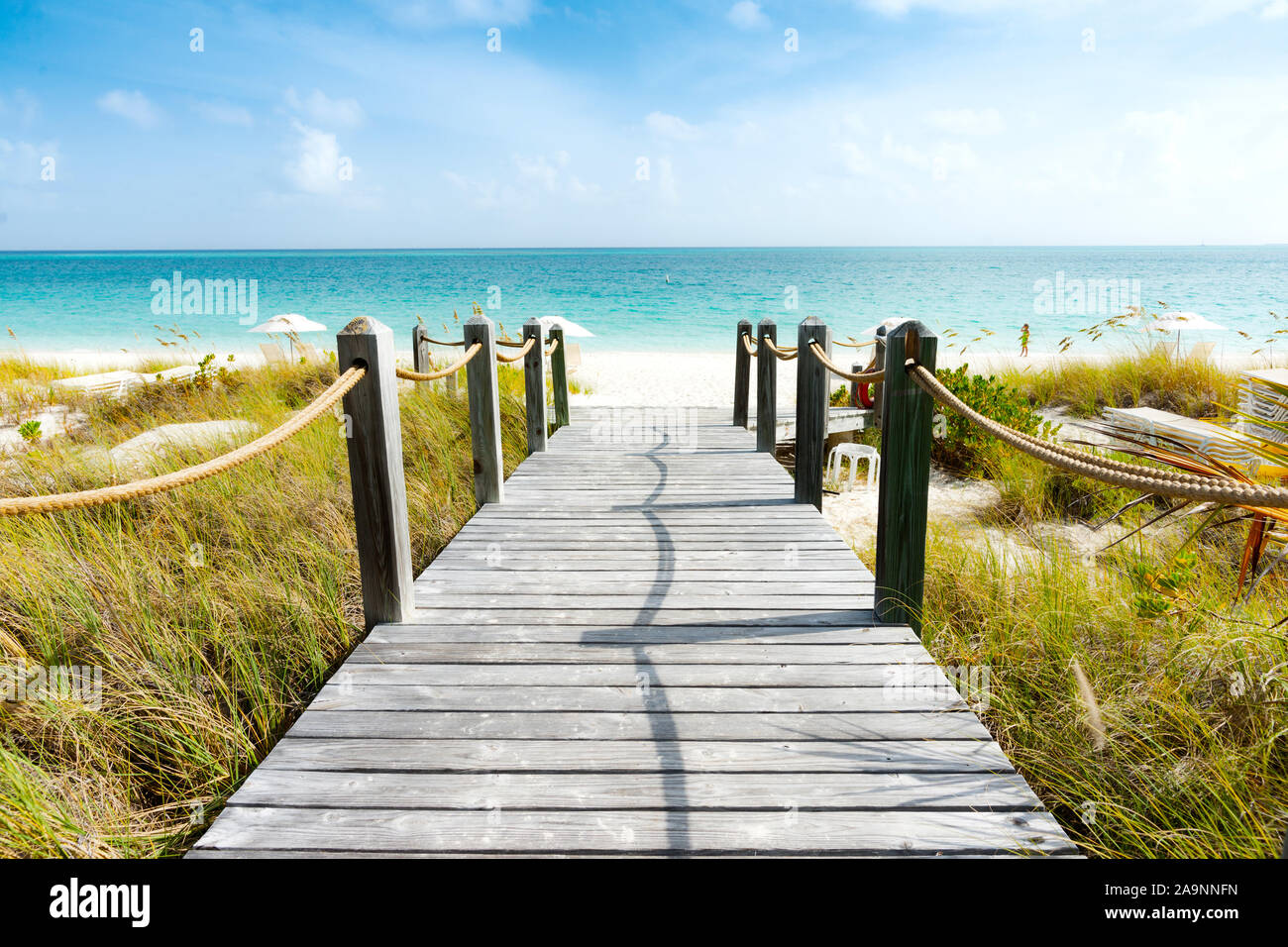 Wooden plank walkway leading to Caribbean beach Stock Photo - Alamy