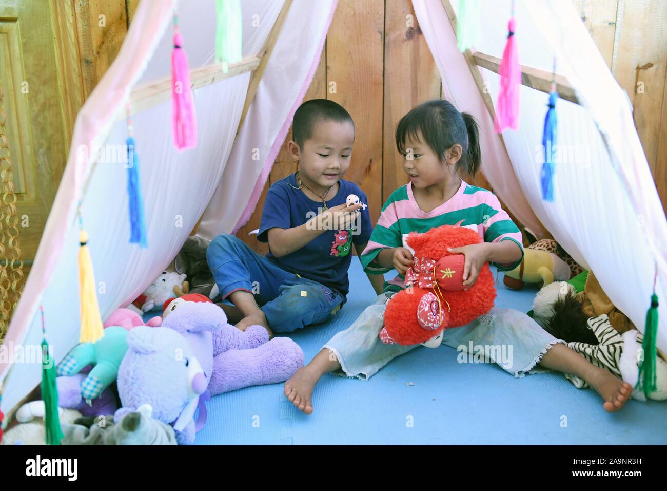 Mengla, China's Yunnan Province. 16th Nov, 2019. Children play at a ...