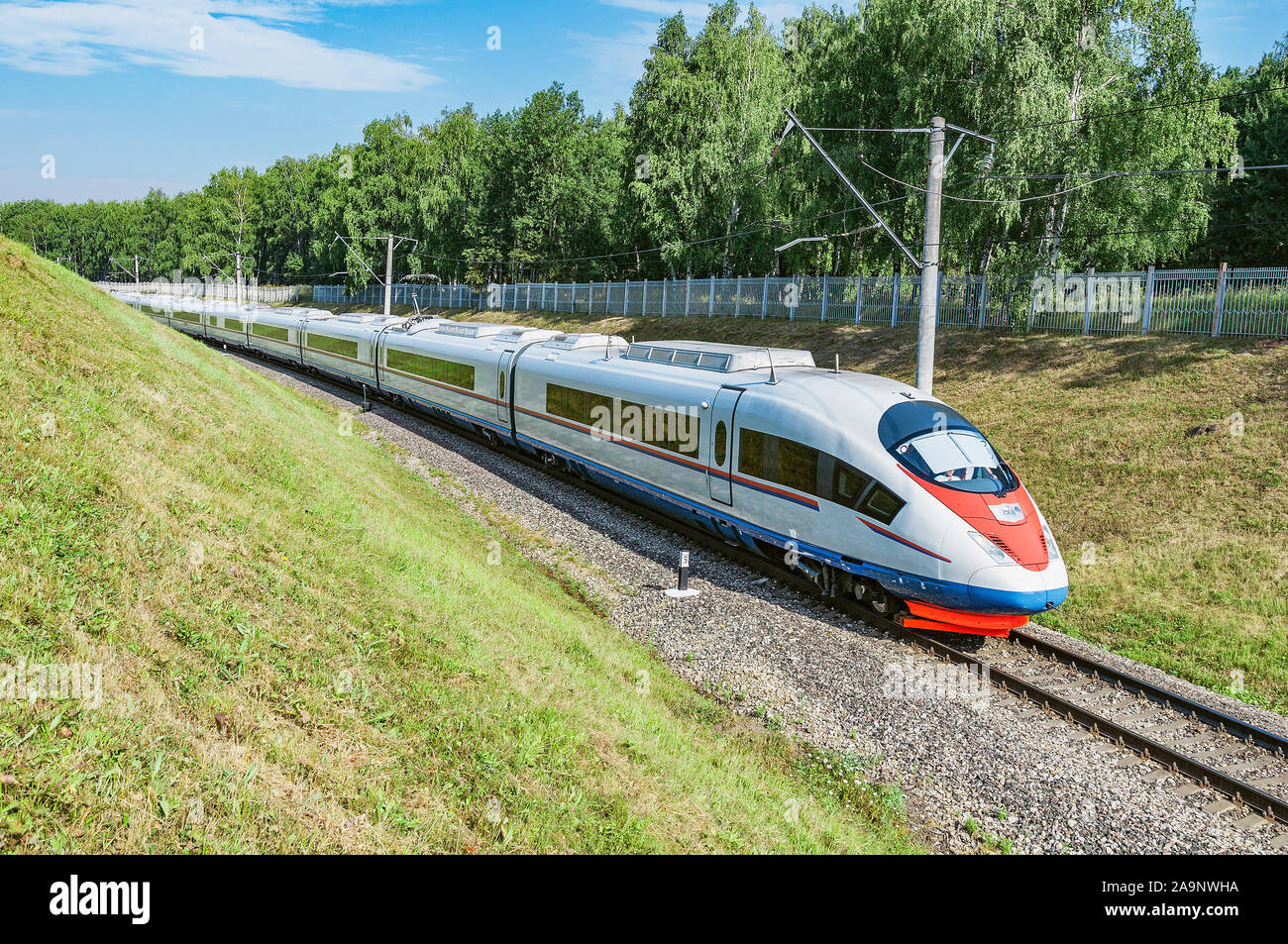 Modern high-speed train moves fast at summer morning time Stock Photo ...