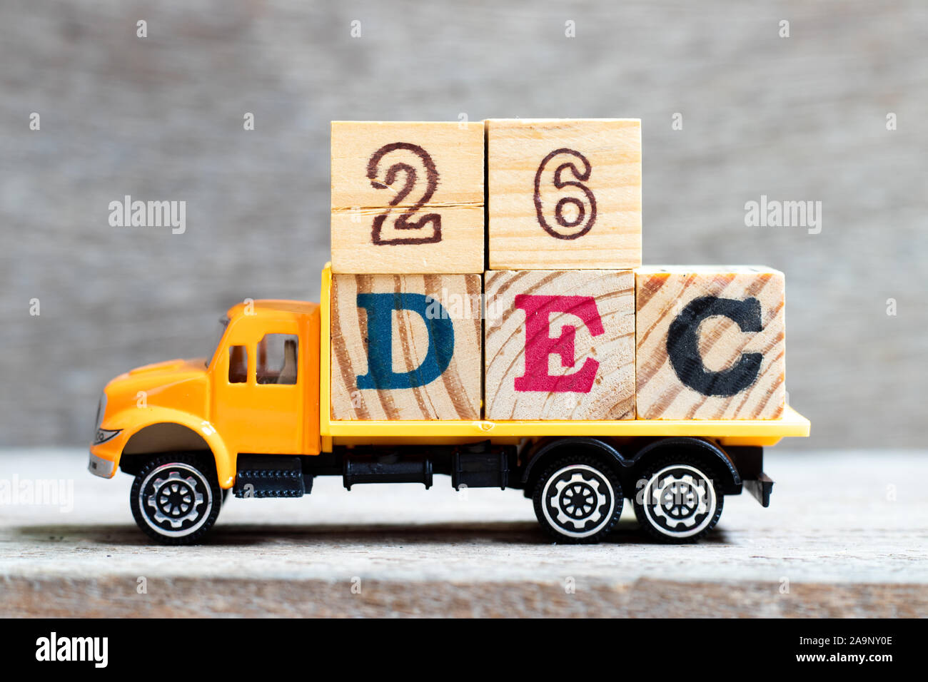 Truck hold letter block in word 26dec on wood background (Concept for ...