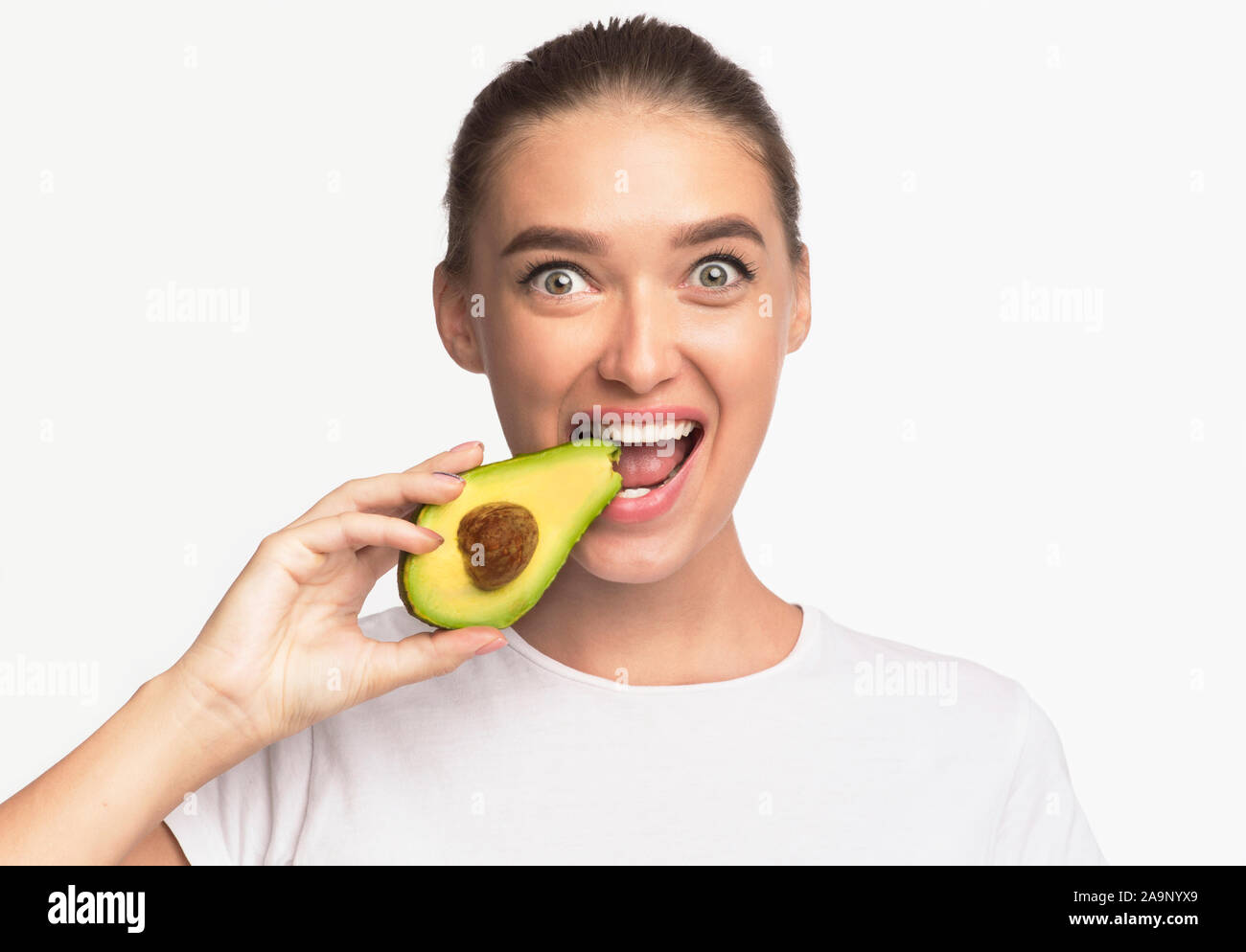 Eating avocado hi-res stock photography and images - Alamy