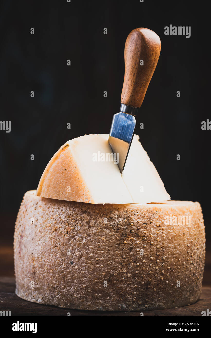 Piece Cut from Whole Matured Cheese Wheel. Traditional Food Produce ...