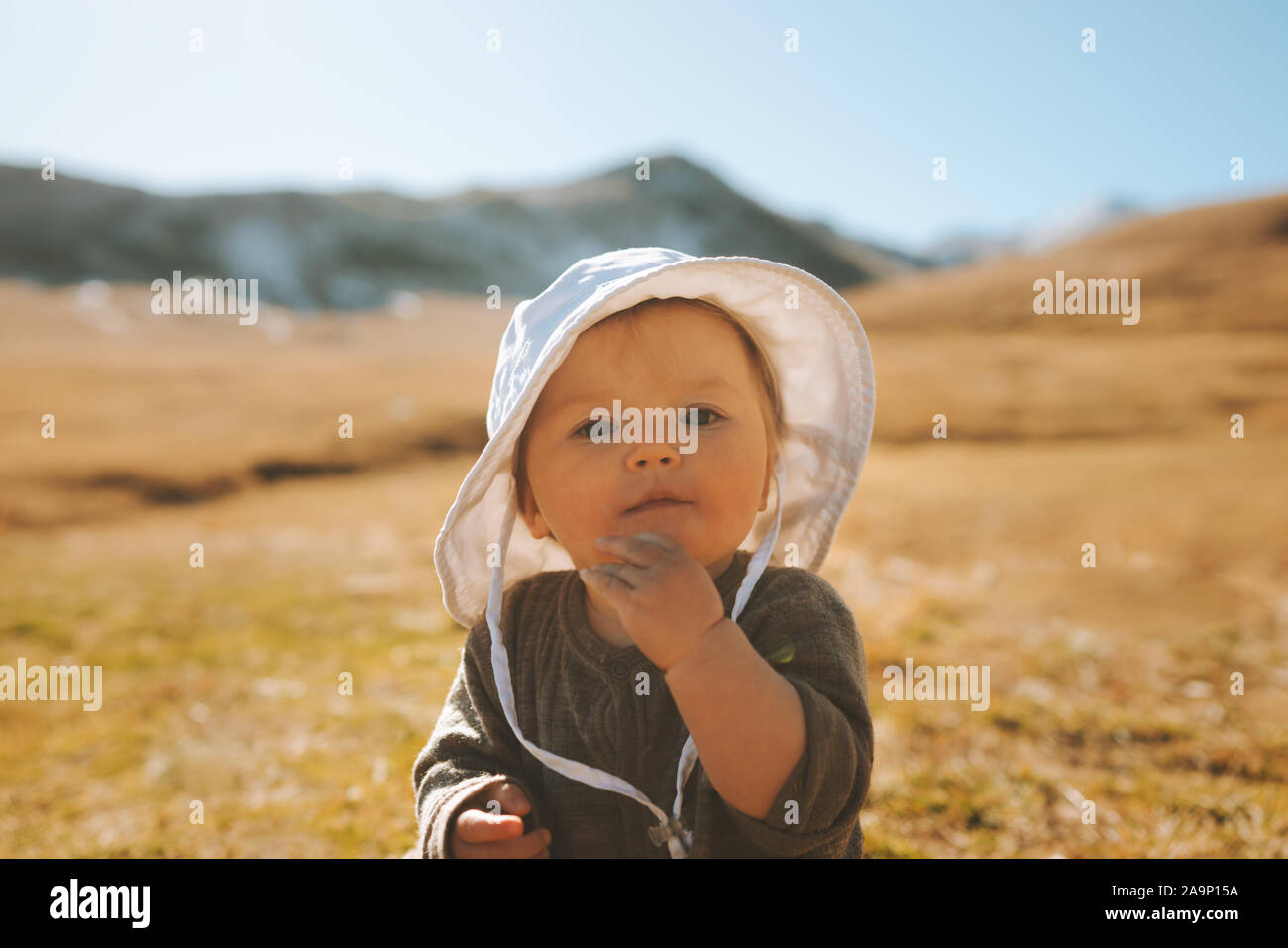 Baby girl traveling in mountains family active lifestyle cute infant ...